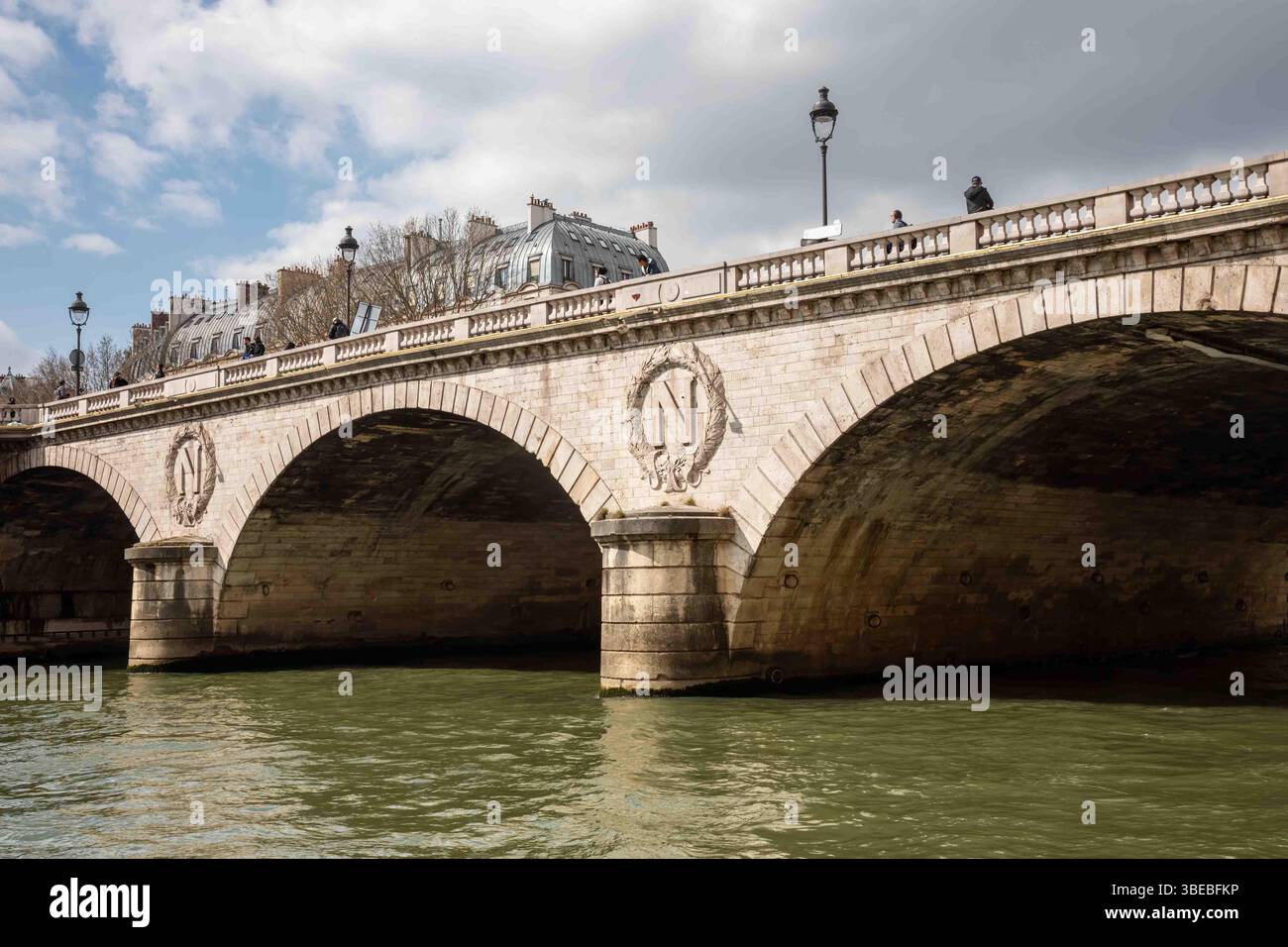 Low-angle view of Pont Saint-Michel arch bridge crossing River Seine in ...