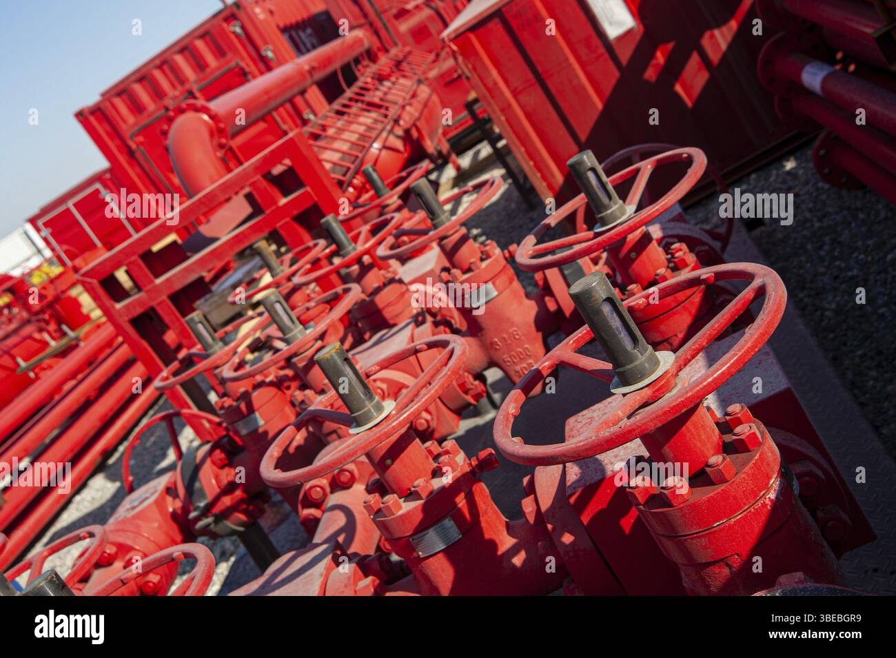 A closeup of a red industrial oil pipeline valves Stock Photo - Alamy