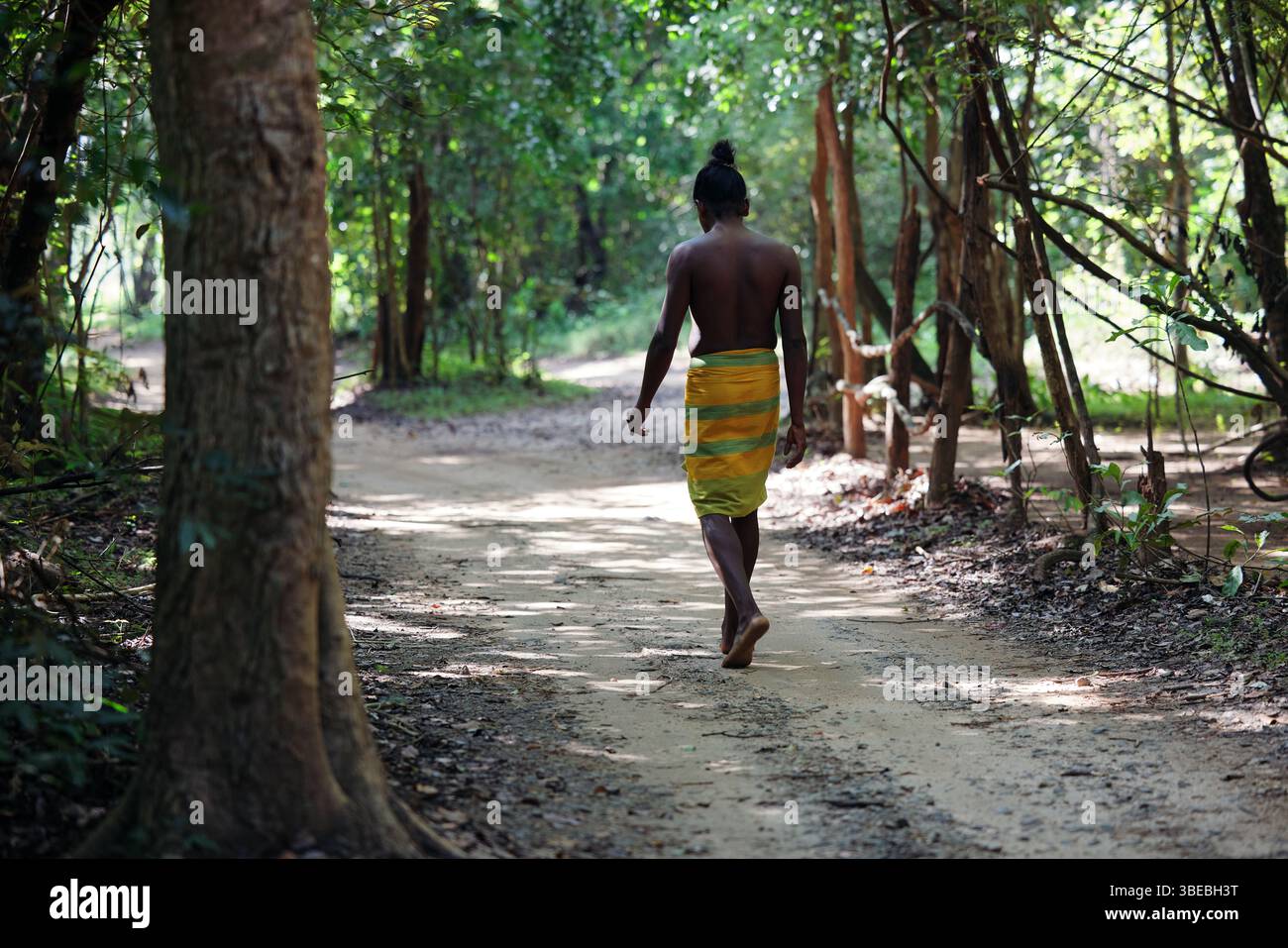 Vedda tribesman of Sri Lanka stands in natural surroundings ...