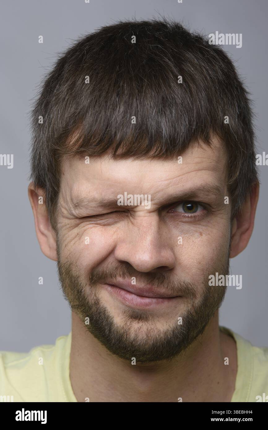 Close-up portrait of a man covering one eye, European appearance Stock ...