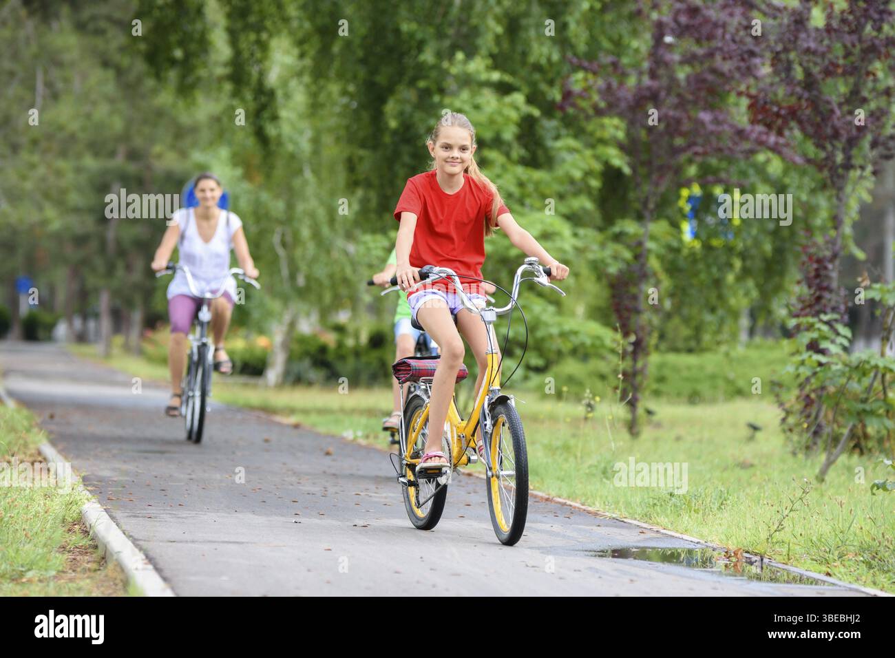 Mother and child ride a bike hi-res stock photography and images - Alamy