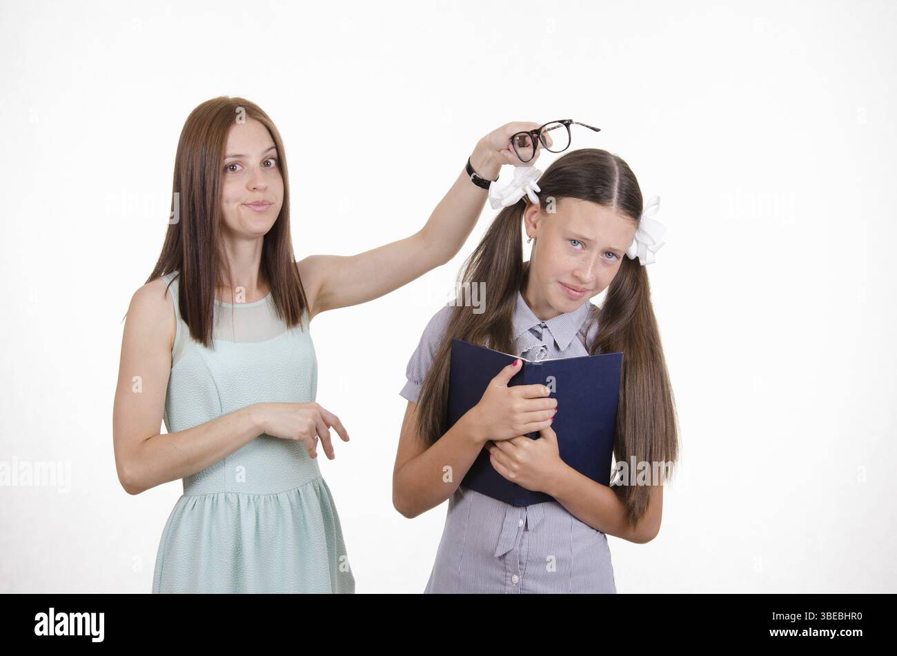 Teacher bangs his hand on the head and scolds student Stock Photo - Alamy