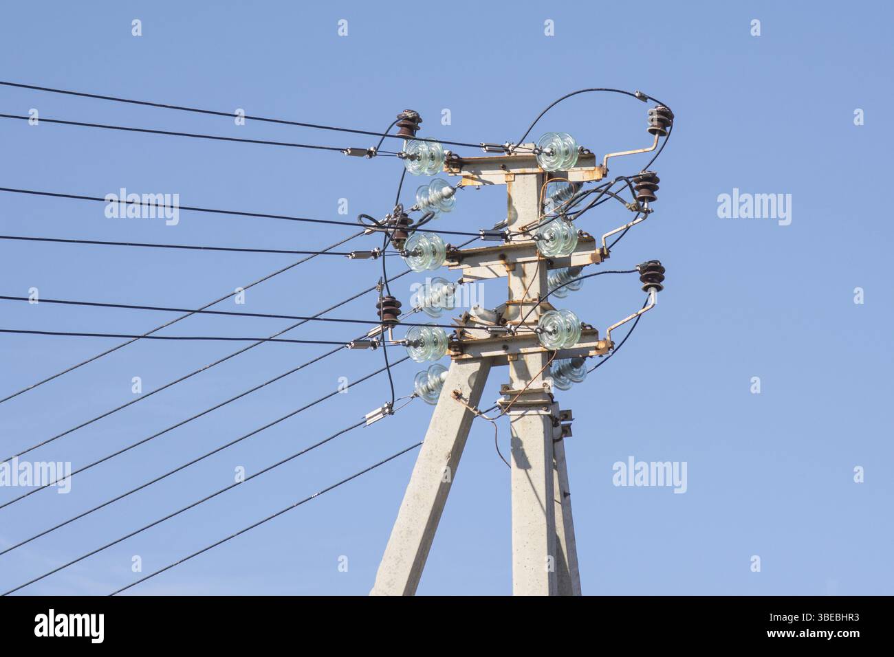 A pillar of power line installed on it, and isolated wires to prop up ...