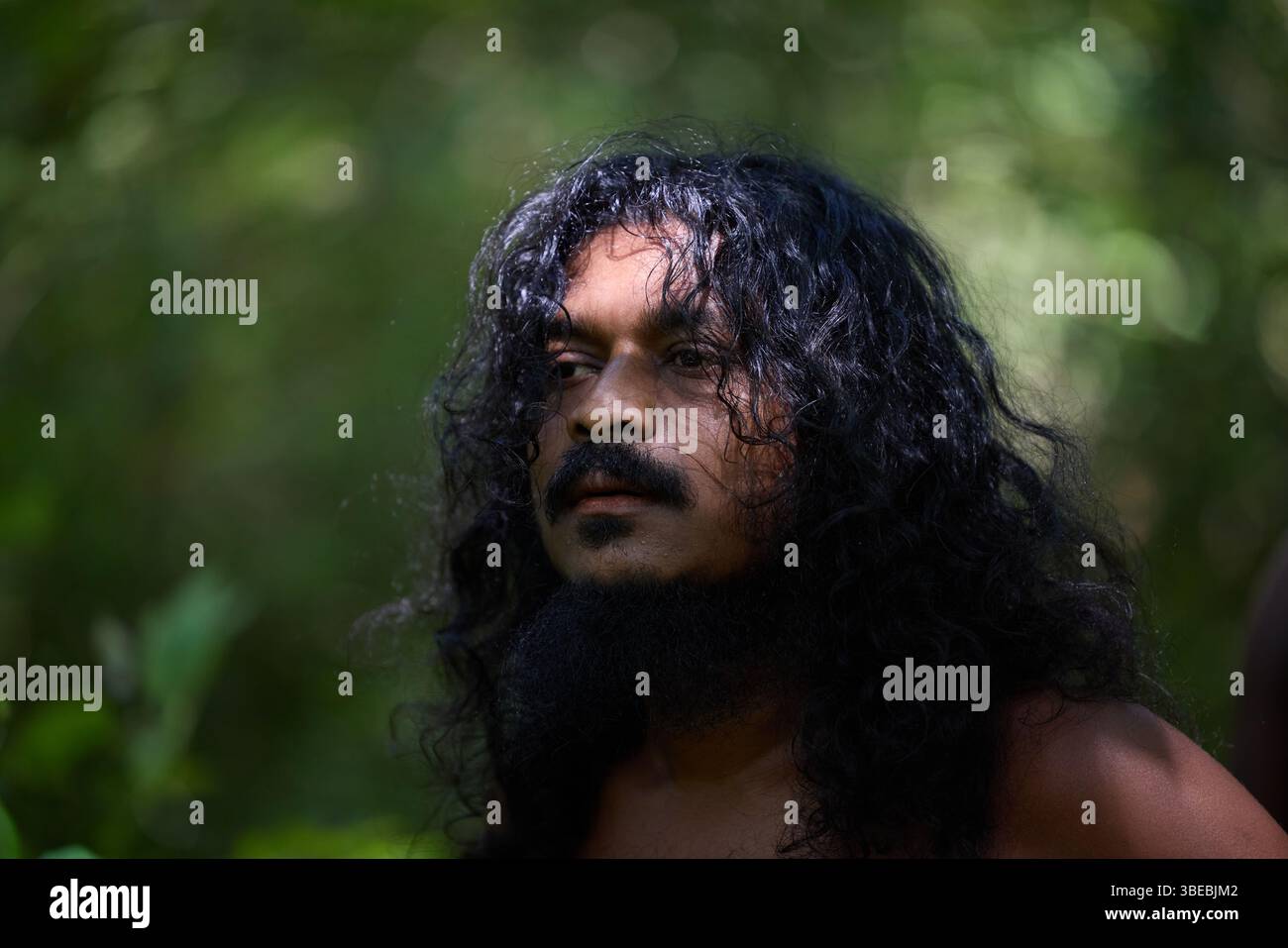 Vedda tribesman of Sri Lanka stands in natural surroundings ...