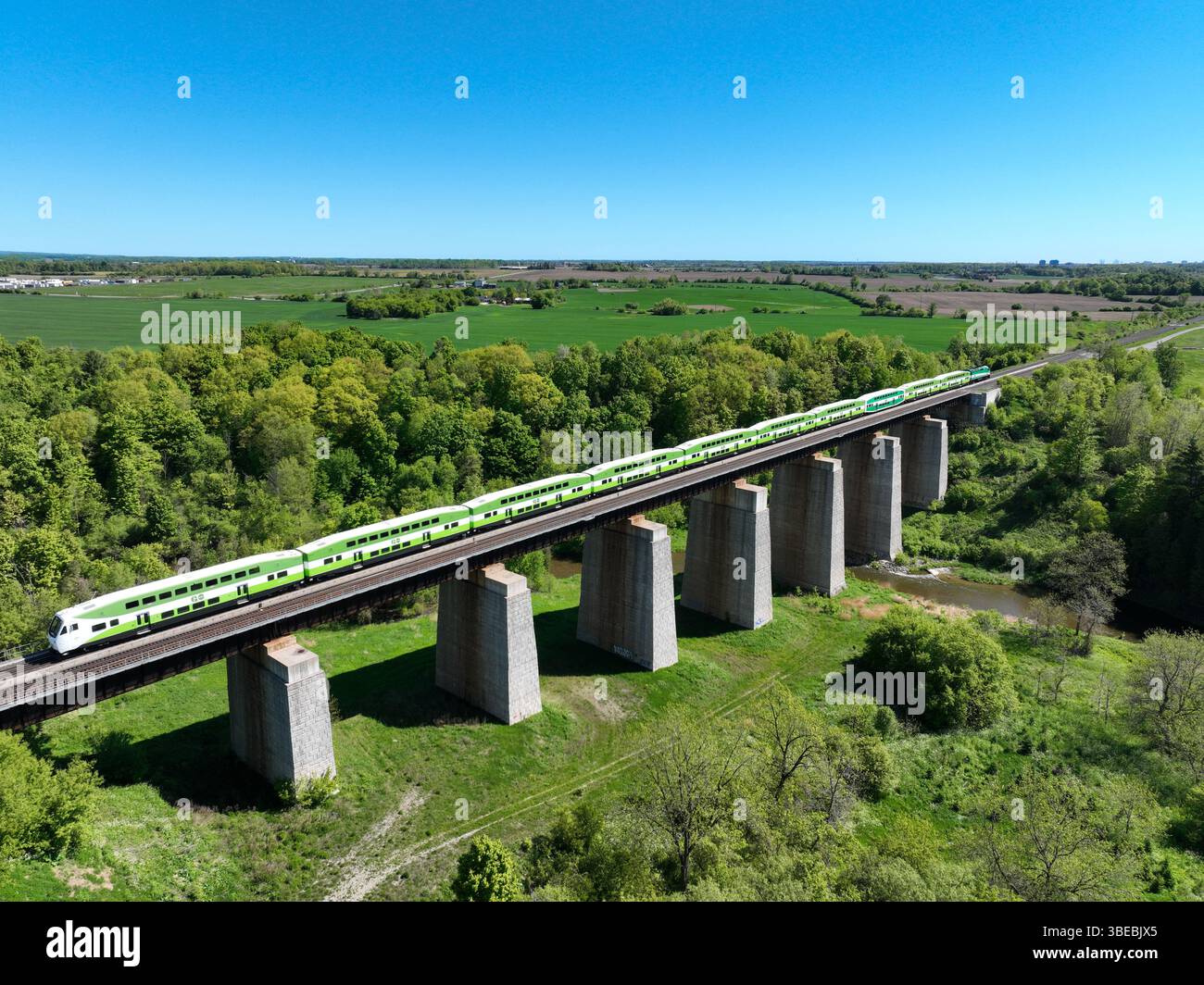 GO Transit commuter train travels across a Georgetown railway trestle ...