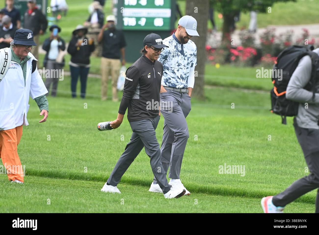 May 28, 2025: Rickie Fowler and Steph Curry walk down the 18th hole ...