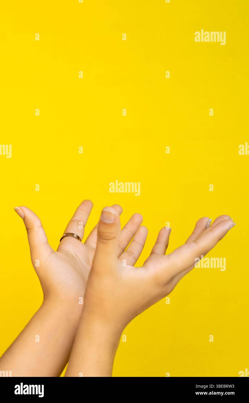 A creative studio composition featuring a human hand extended on a ...