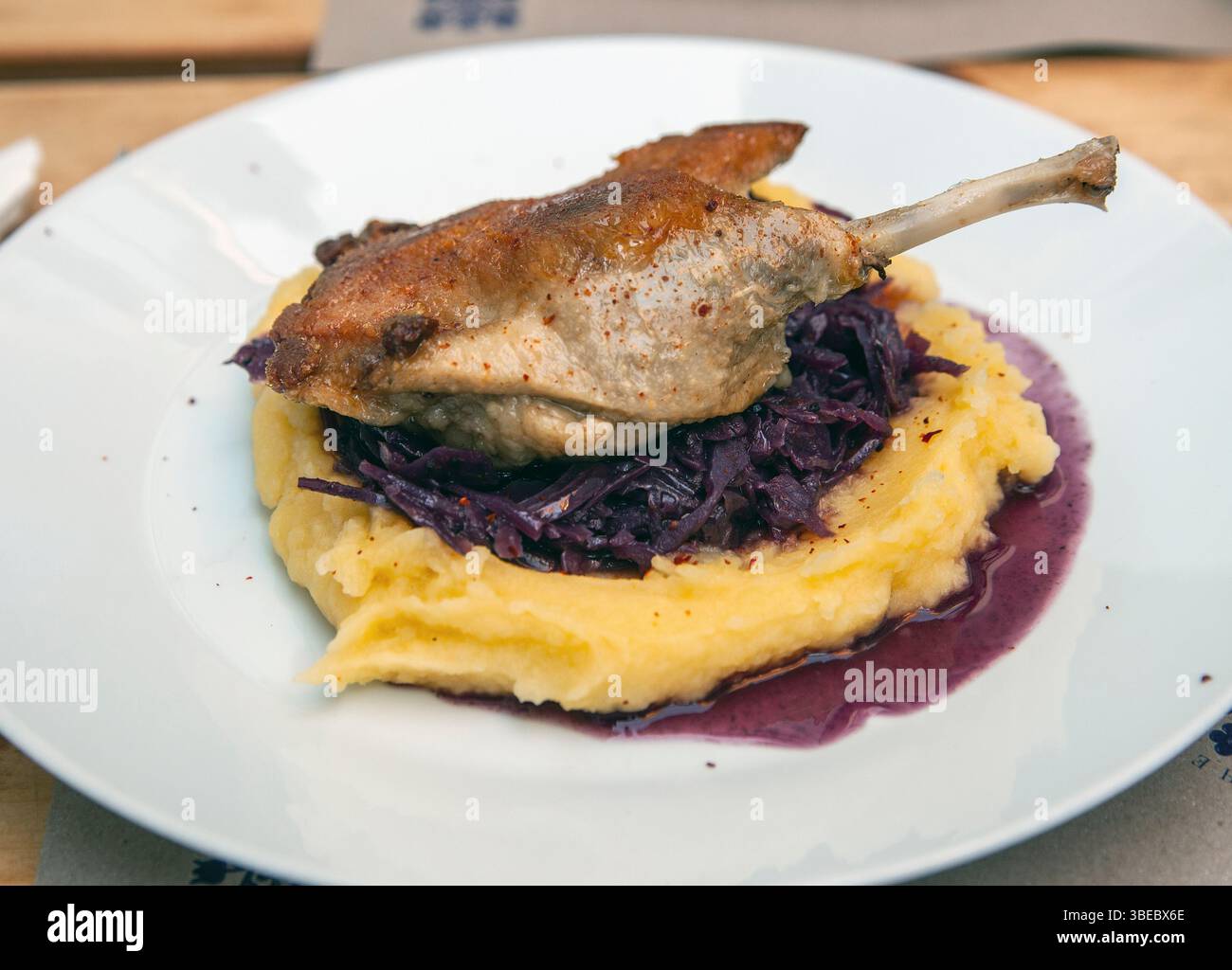 Duck leg with braised cabbage, mashed potato , top view Stock Photo - Alamy