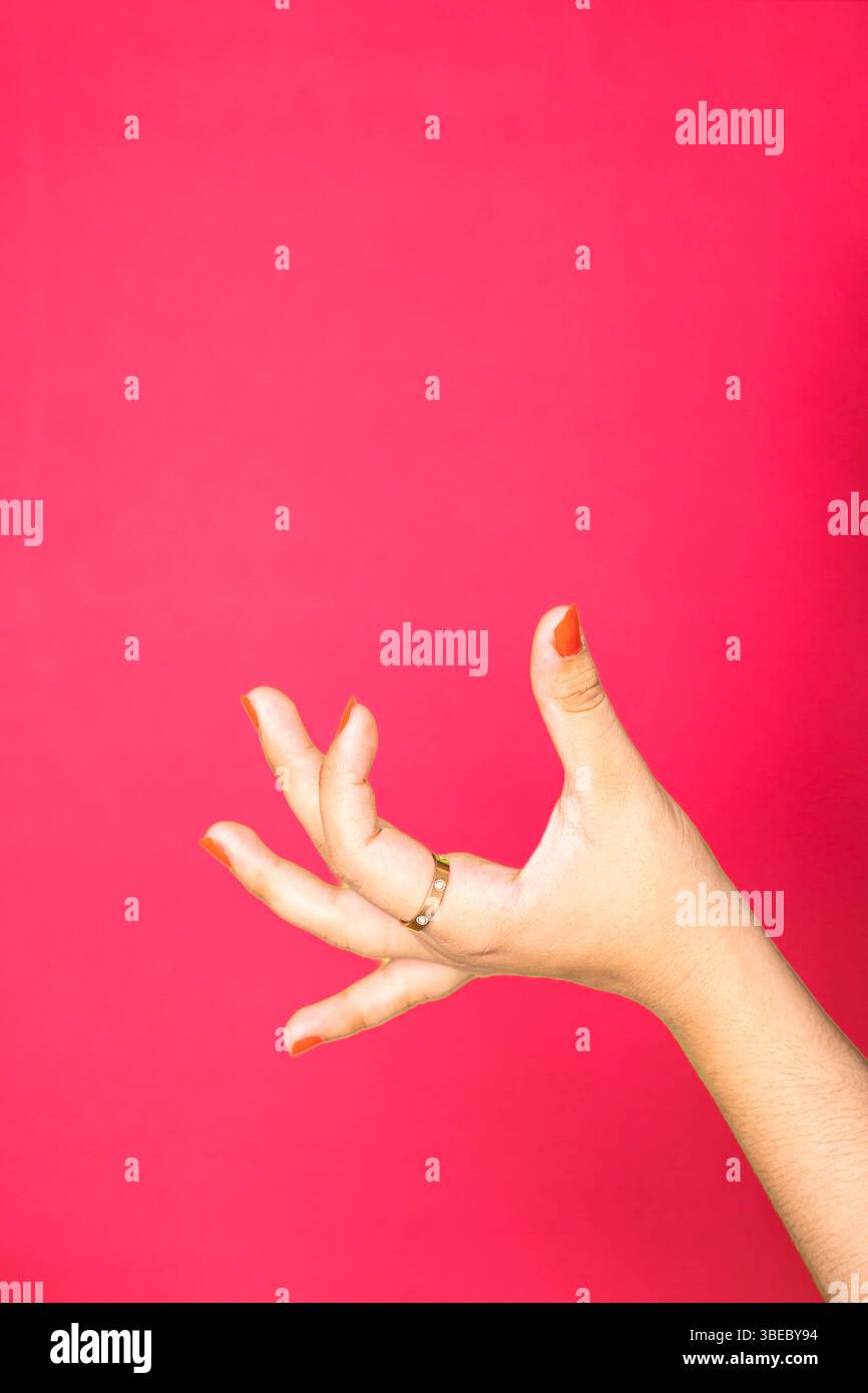 A sleek and polished hand gesture on a solid color background, creating ...