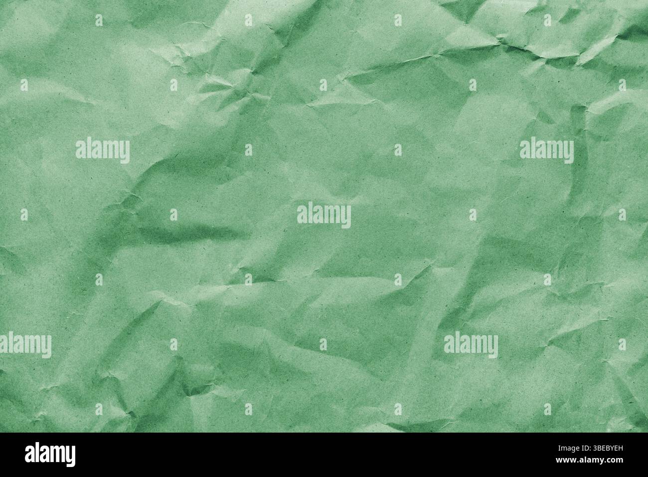 Recycled crumpled green colored paper texture. Wrinkled craft paper ...