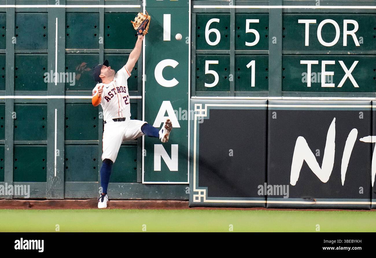 Houston Astros left fielder Jose Altuve (27) leaps against the wall to ...