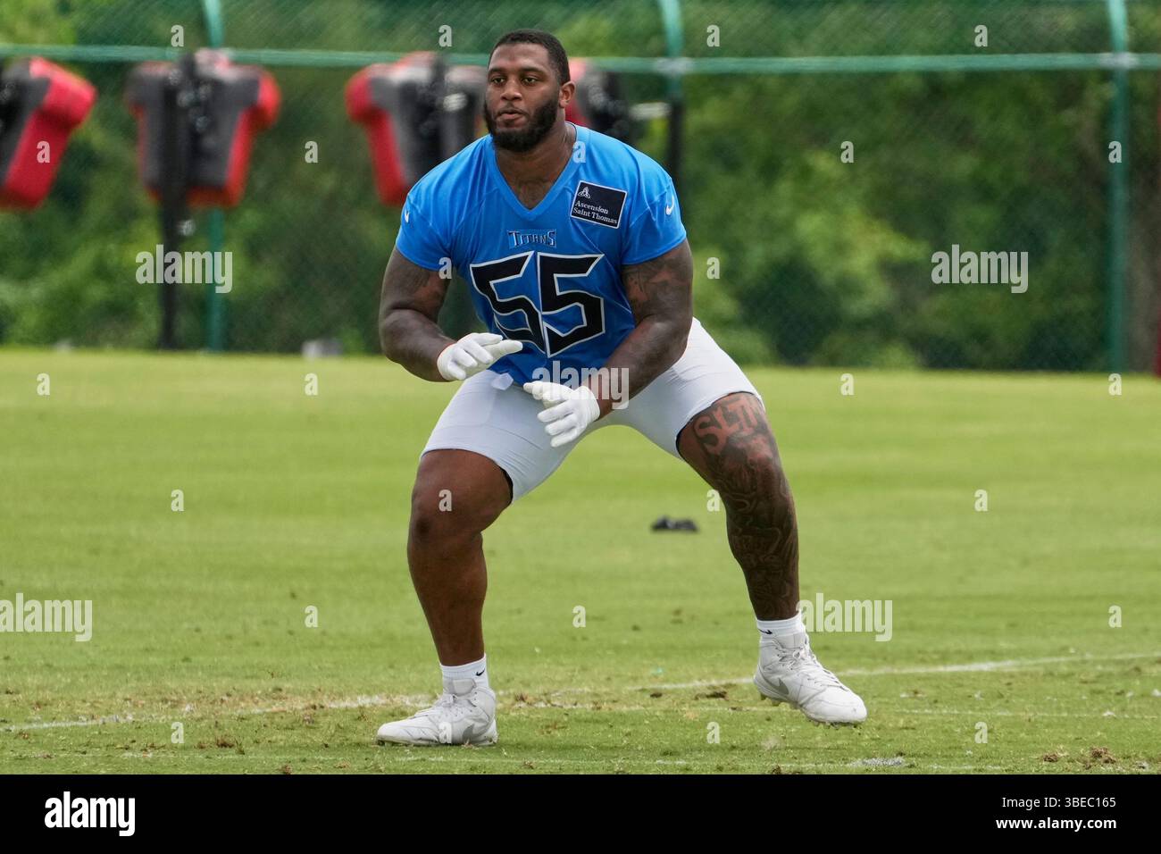 Tennessee Titans offensive tackle JC Latham (55) runs through a drill ...