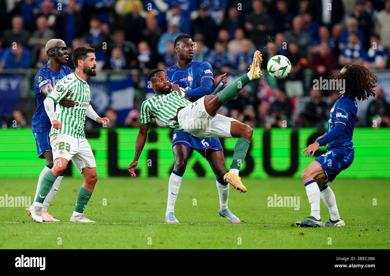 Real Betis' Cedric Bakambu and Chelsea's Benoit Badiashile battle for ...