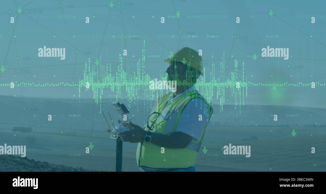 Engineer wearing hard hat and safety vest piloting drone with remote on ...