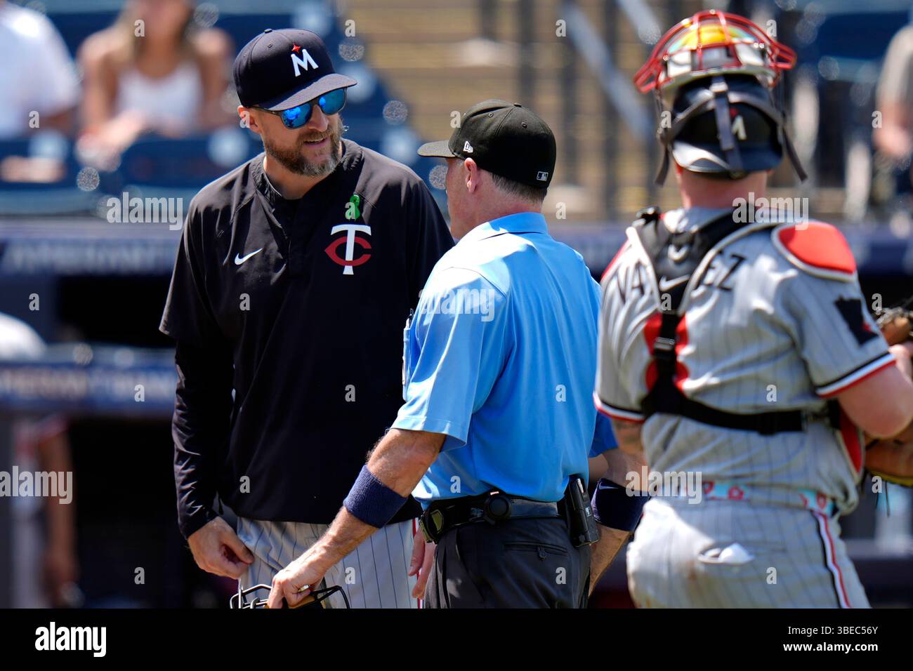 Minnesota Twins manager Rocco Baldelli, left, questions home plate ...