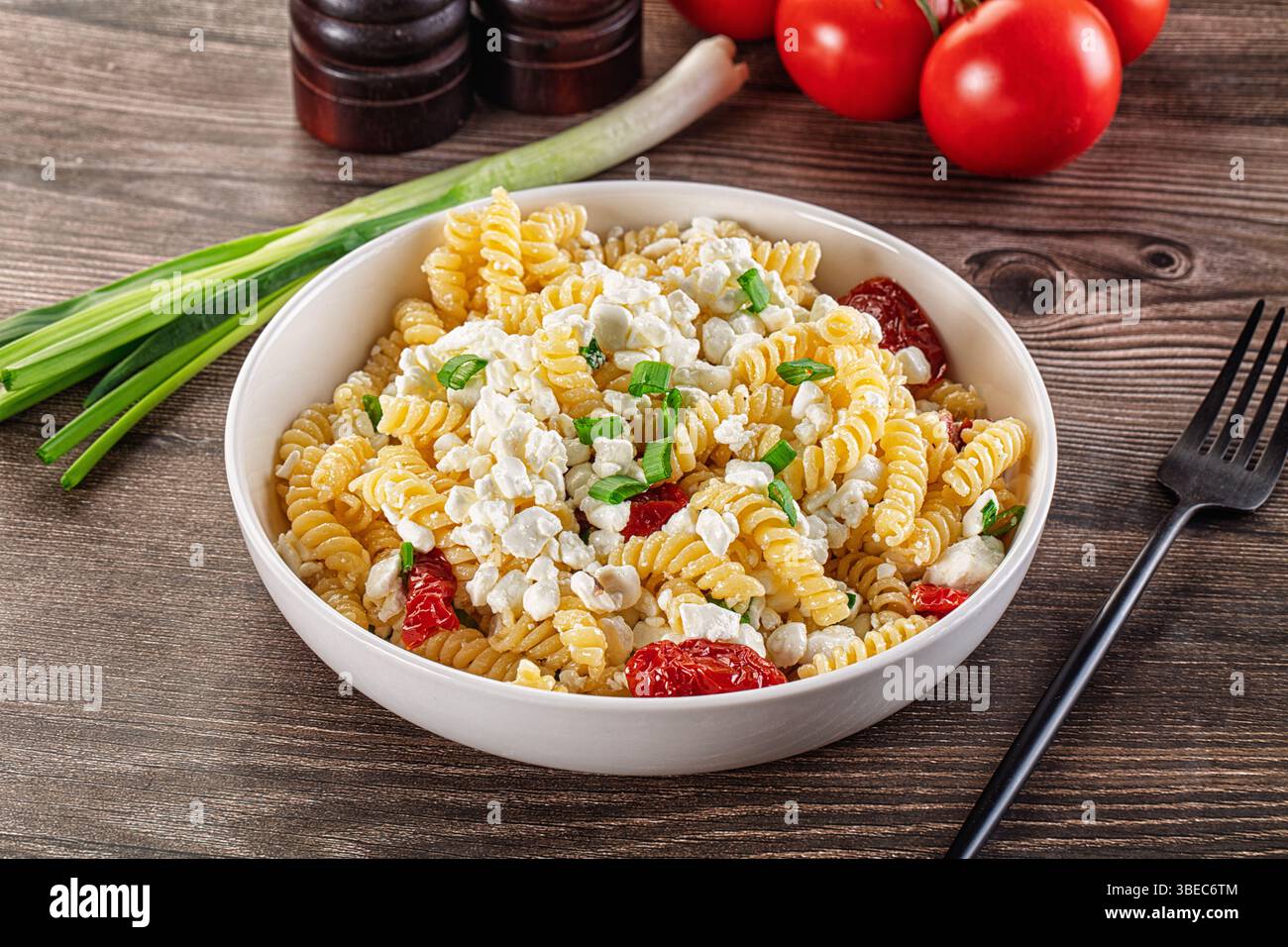 Italian pasta fusili with curd and dry tomato Stock Photo - Alamy