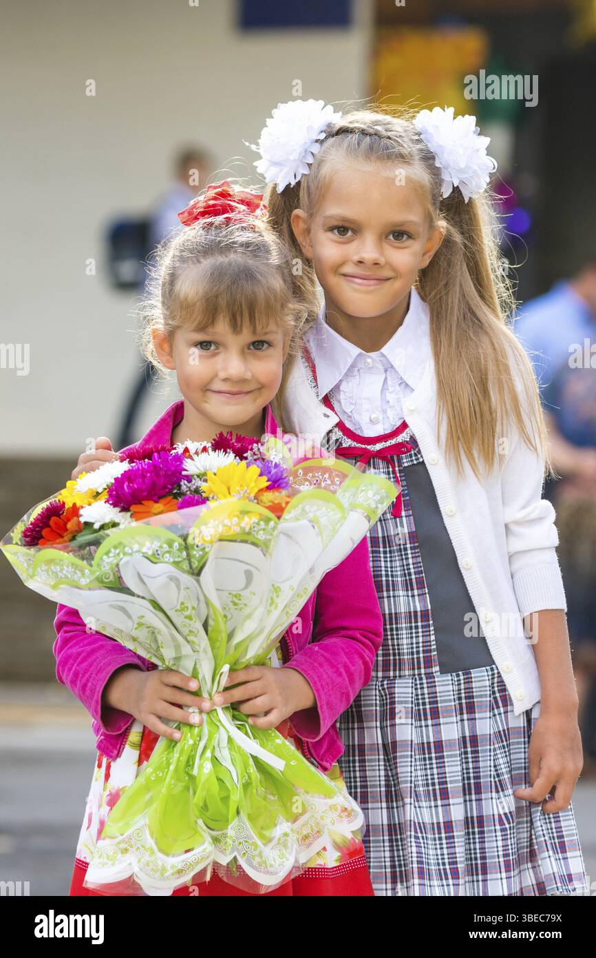 Portrait of two girls in school September 1 - the first-grader and her ...