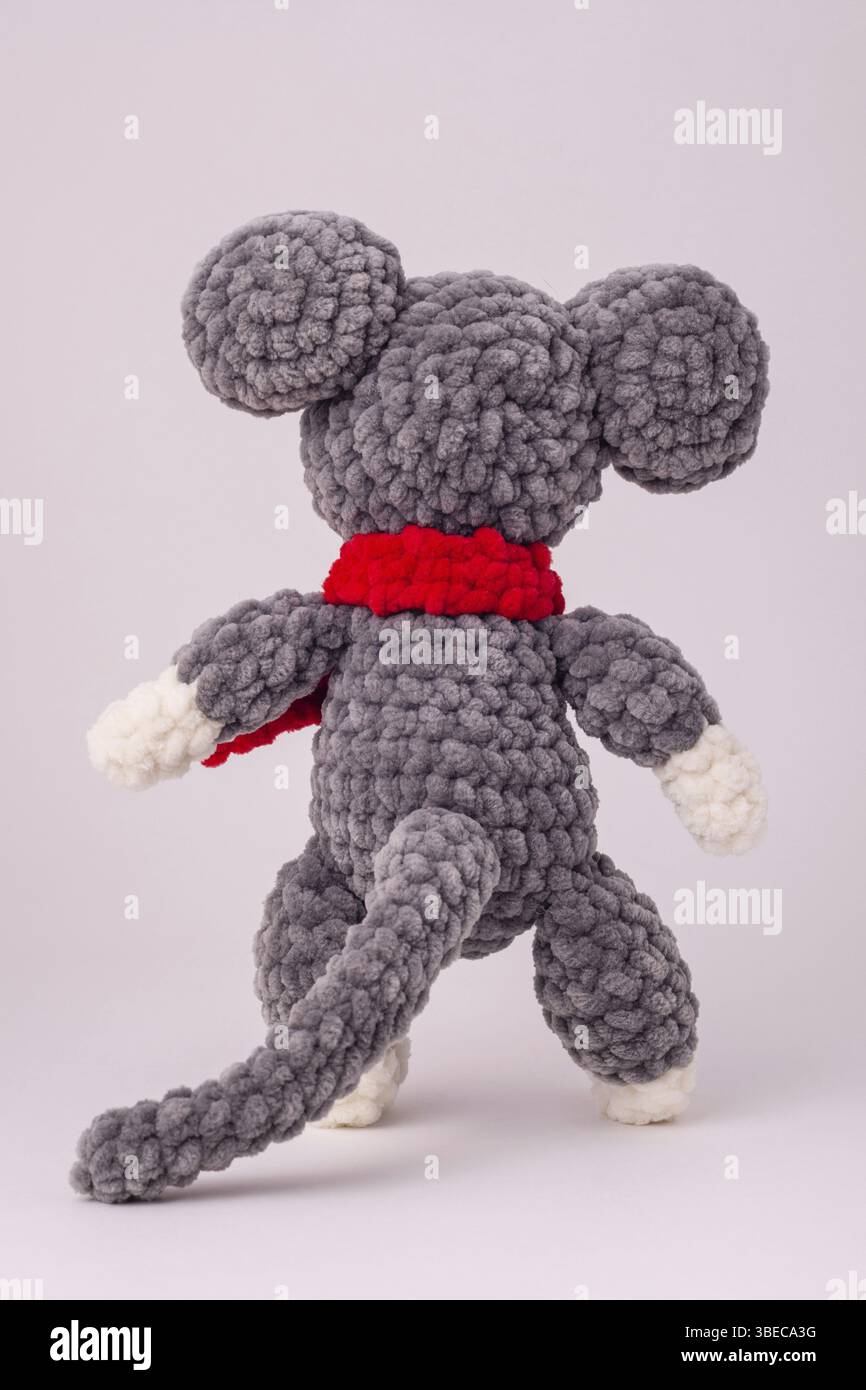 Funny knitted teddy mouse, Rear view, white background Stock Photo - Alamy