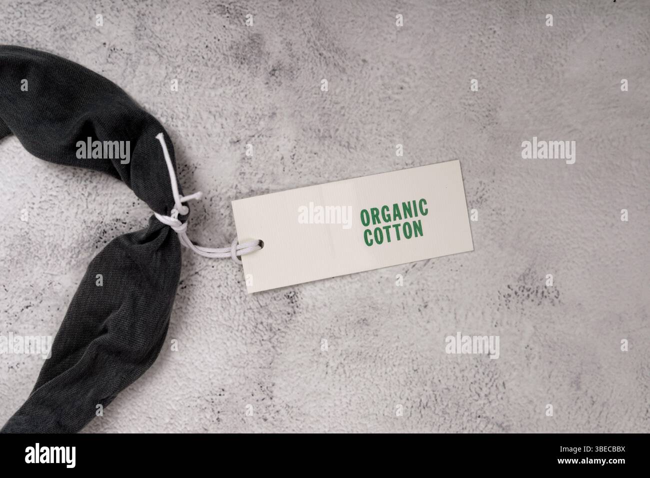 organic cotton label attached to a piece of cloth Stock Photo - Alamy