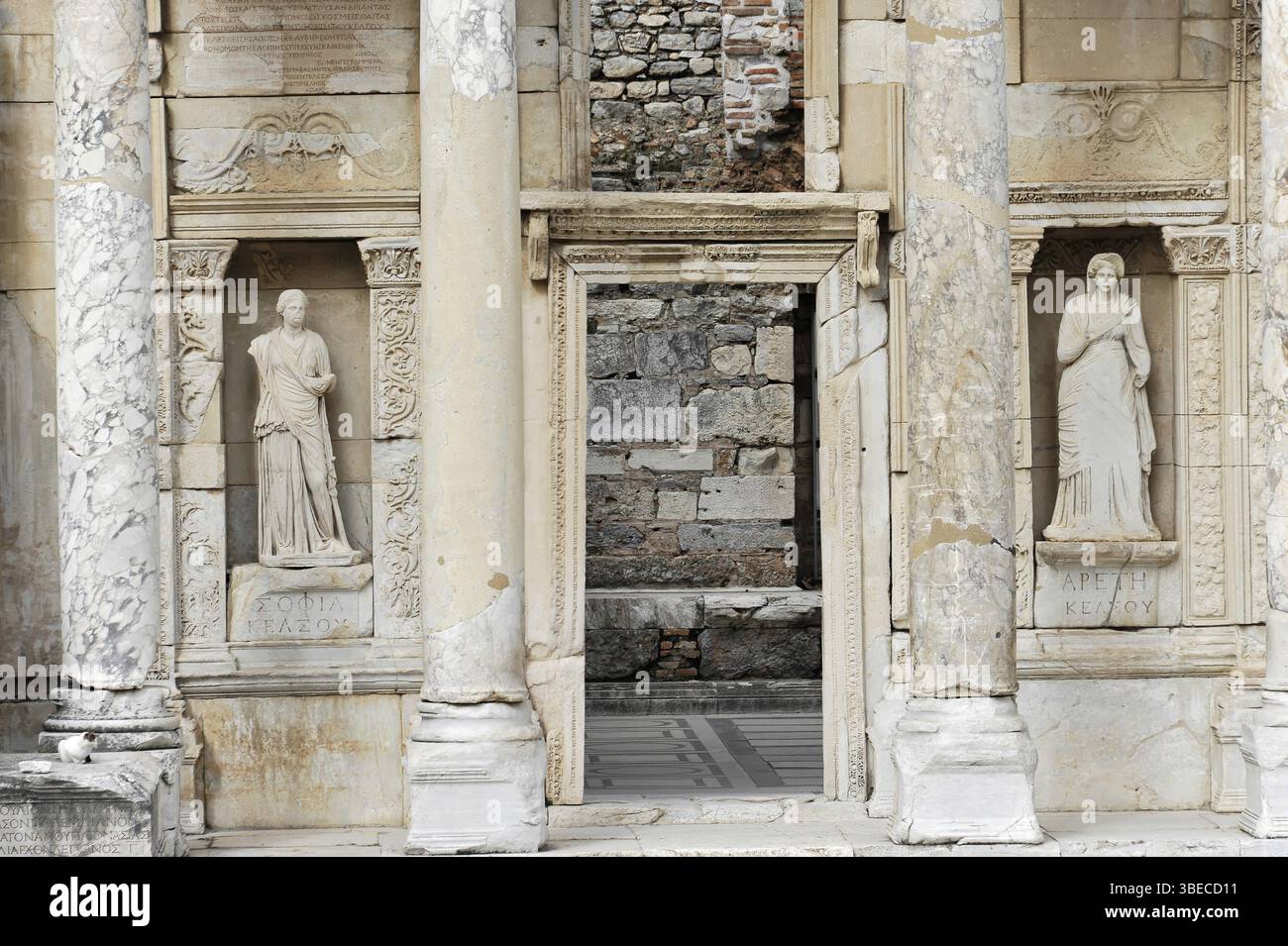 Ancient facade details with sculptures, Turkey, Ephesus: tourists ...