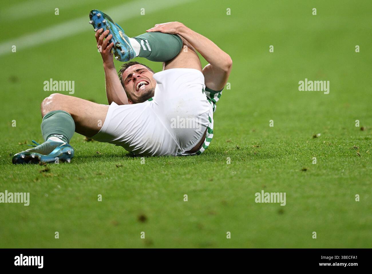 Real Betis' Romain Perraud goes down injured after being fouled by ...