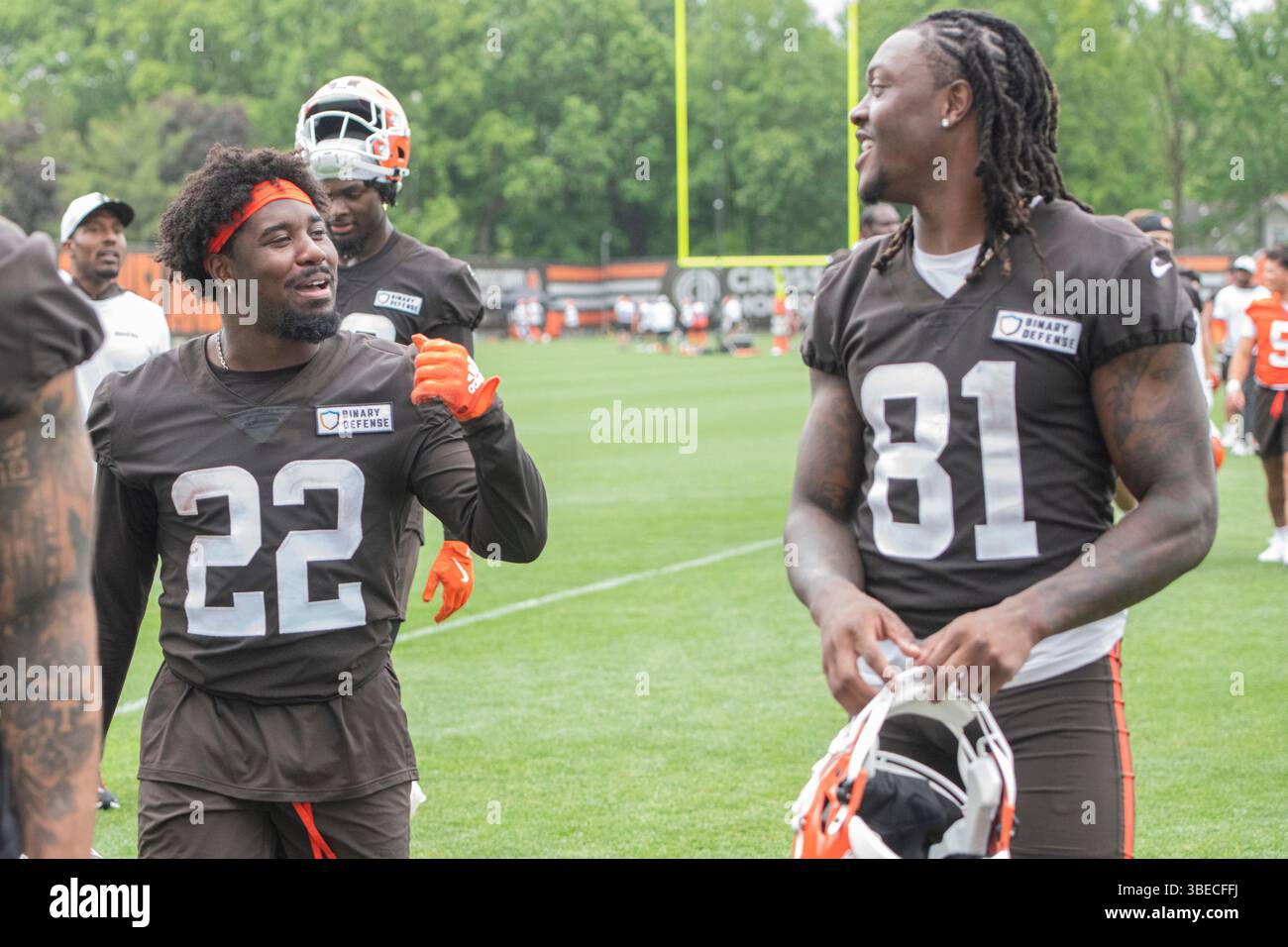 Cleveland Browns' Dylan Sampson (22) walks off the field with Michael ...