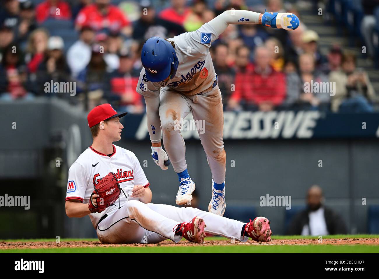 Los Angeles Dodgers' Enrique Hernandez steps over Cleveland Guardians ...