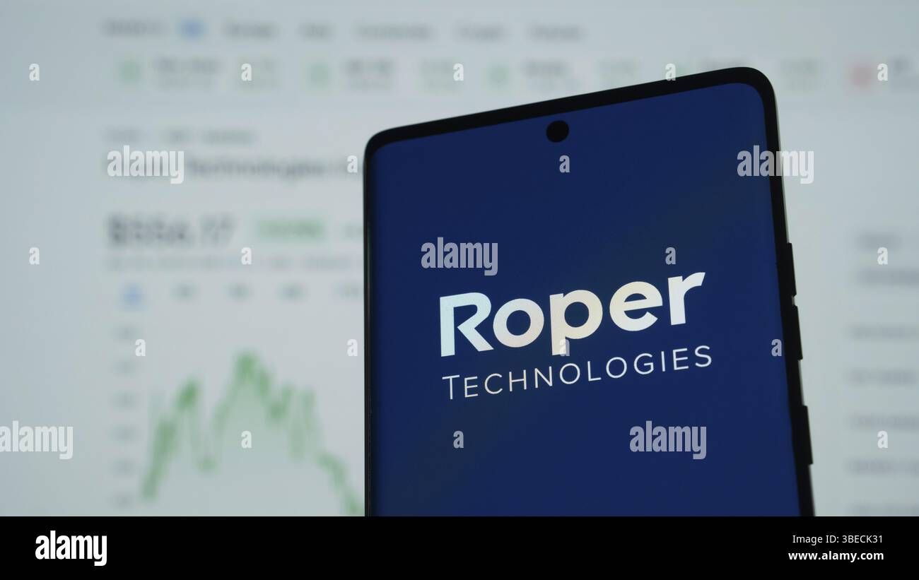 Roper Technologies logo on a smartphone screen with a blurred financial ...