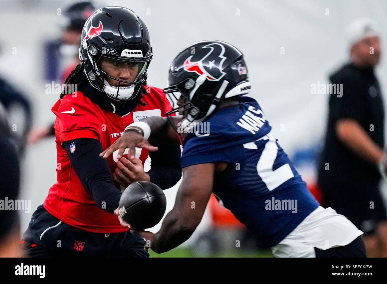 Houston Texans quarterback C.J. Stroud (7) hands the ball off to ...