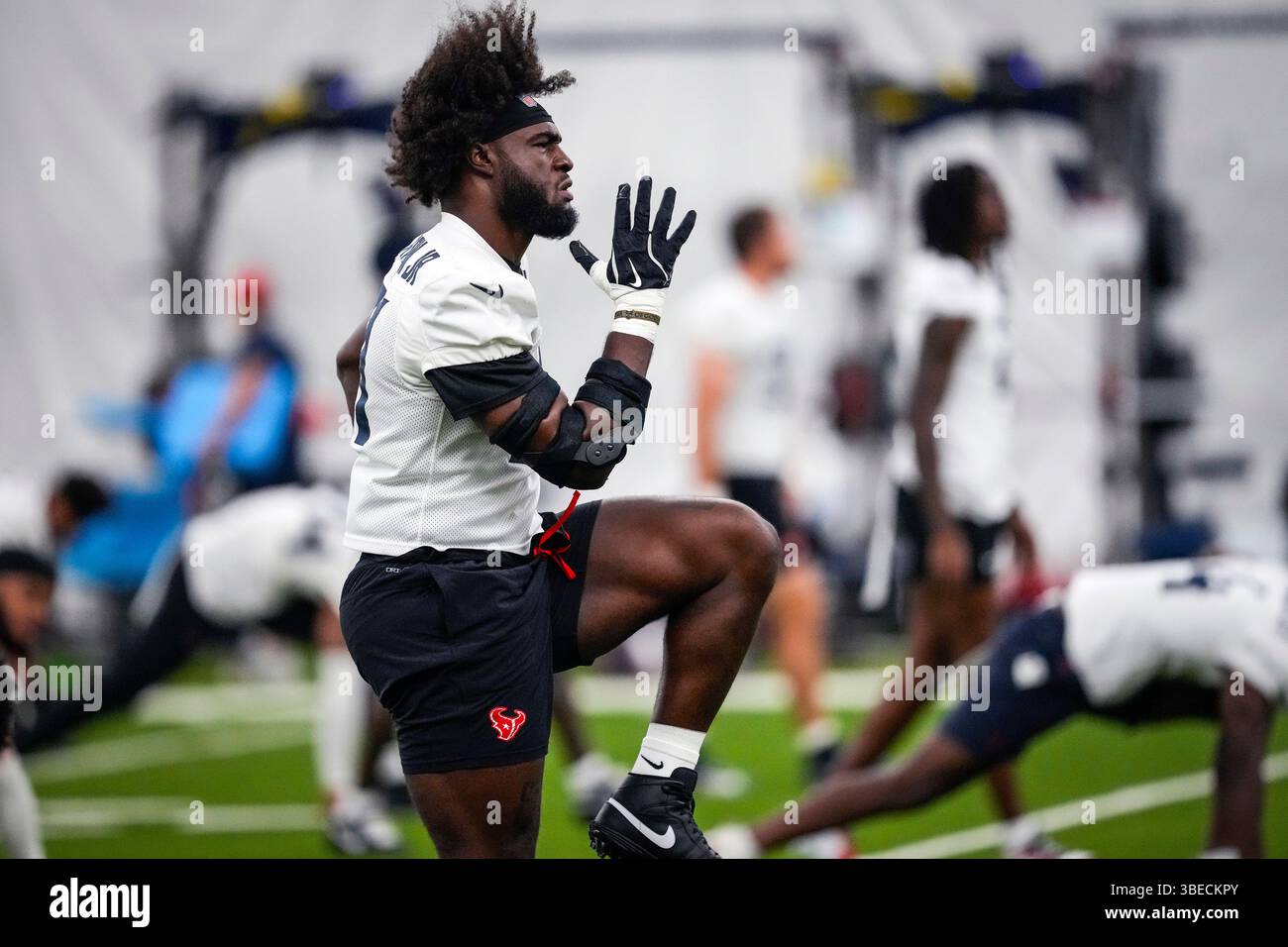 Houston Texans defensive end Will Anderson Jr. (51) high steps while ...