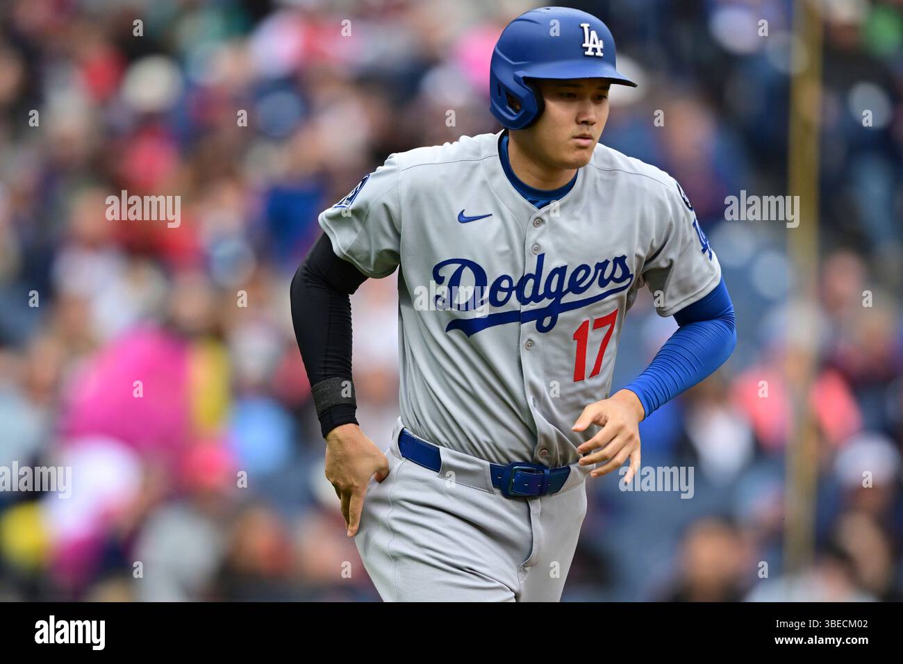 Los Angeles Dodgers' Shohei Ohtani walks to first base during the ...