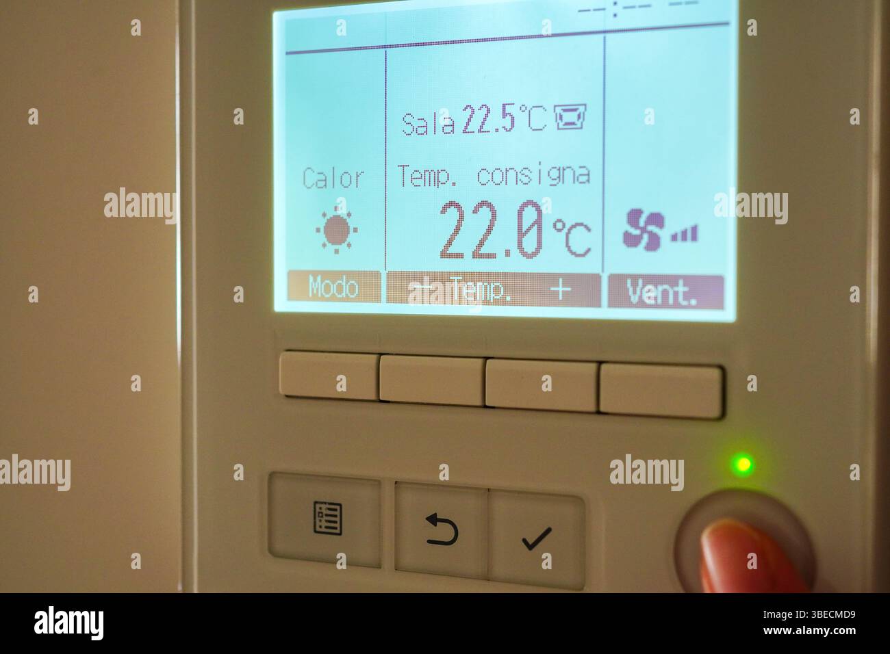 AIR CONDITIONING WALL CONTROLLER and finger pushing button to turn on ...