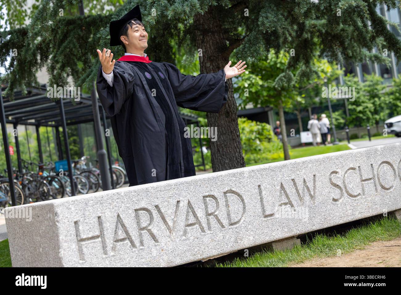 May 28, 2025, Cambridge, Massachusetts, USA: A graduate poses by the â ...