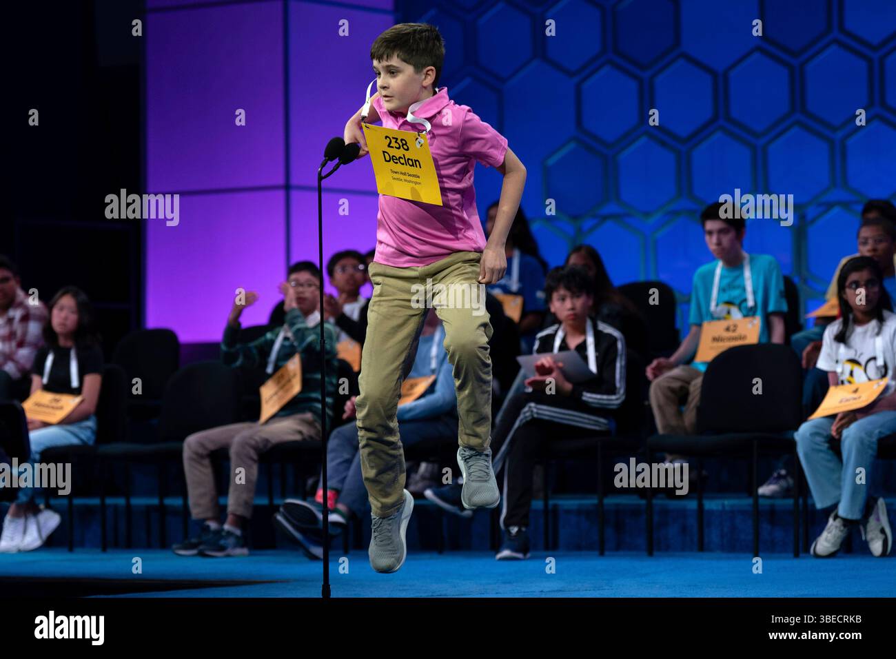Declan Mallady, 12, of Seattle, jumps after he spells his word ...