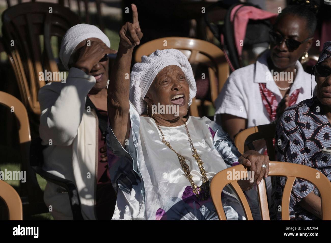 A woman joins a singer performing in Dimona, Israel as the Hebrew ...