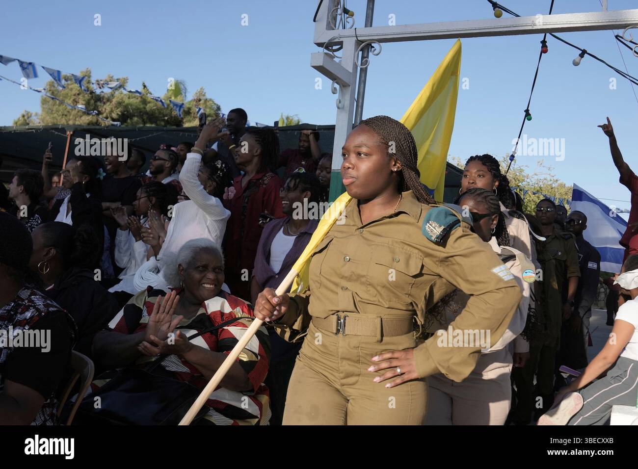 A woman wears her Israeli Defense Forces uniform before marching in a ...