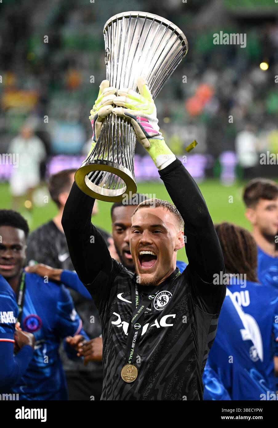 Chelsea goalkeeper Filip Jorgensen lifts the trophy after winning the ...
