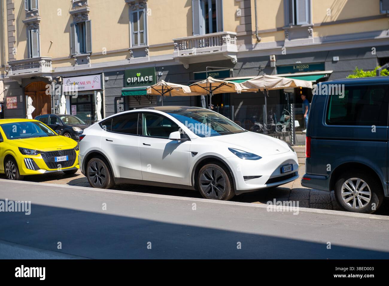 Modern electric Tesla SUV on Milan street, stylish design, clean energy ...