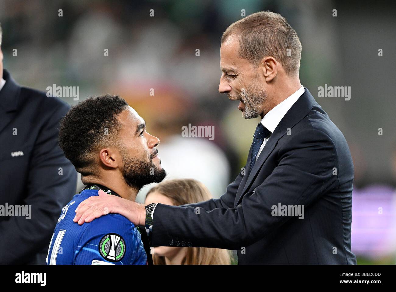 UEFA president Aleksander Ceferin (right) presents a winners medal to ...