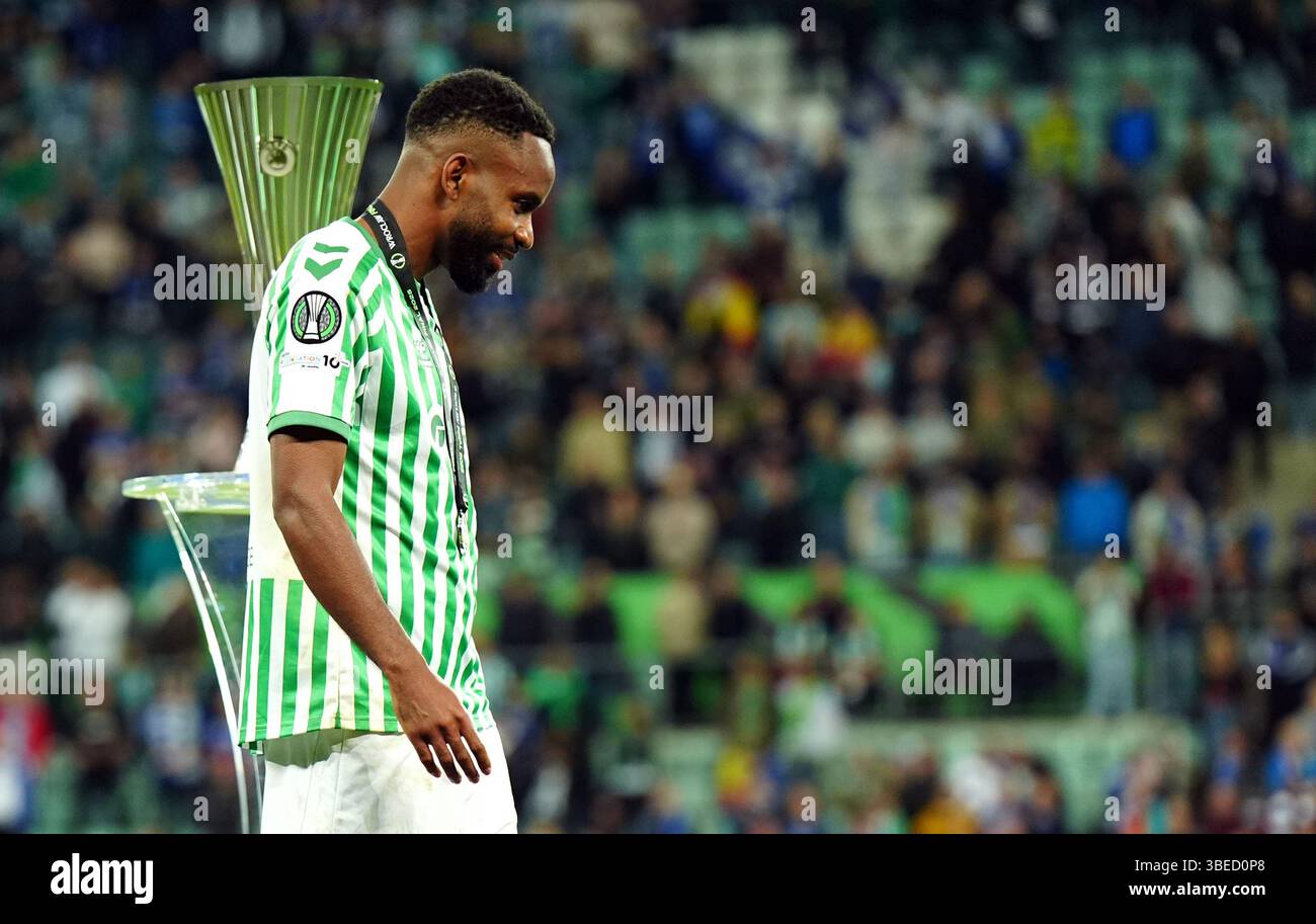 Real Betis' Cedric Bakambu walks past the trophy following the UEFA ...