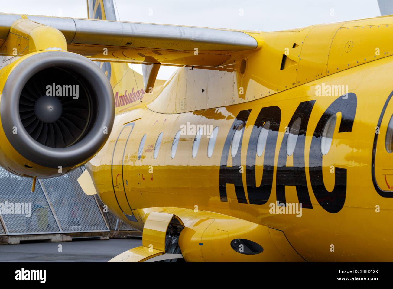Nuremberg, Germany - 25th May 2025: Close-up of a yellow ADAC ambulance ...