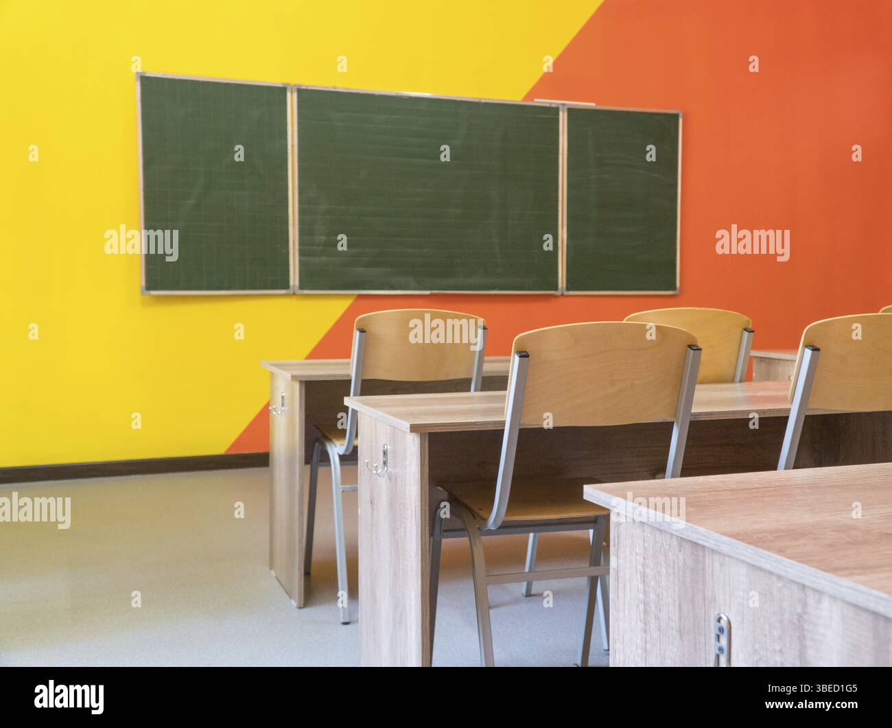 An empty school classroom with a blackboard. Interior of a school ...