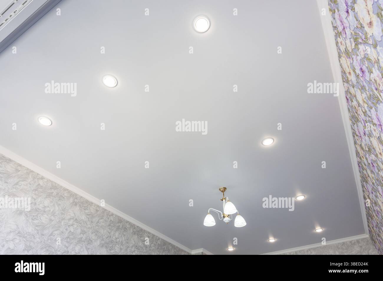 An outline of a stretch ceiling in a room with a chandelier and ...