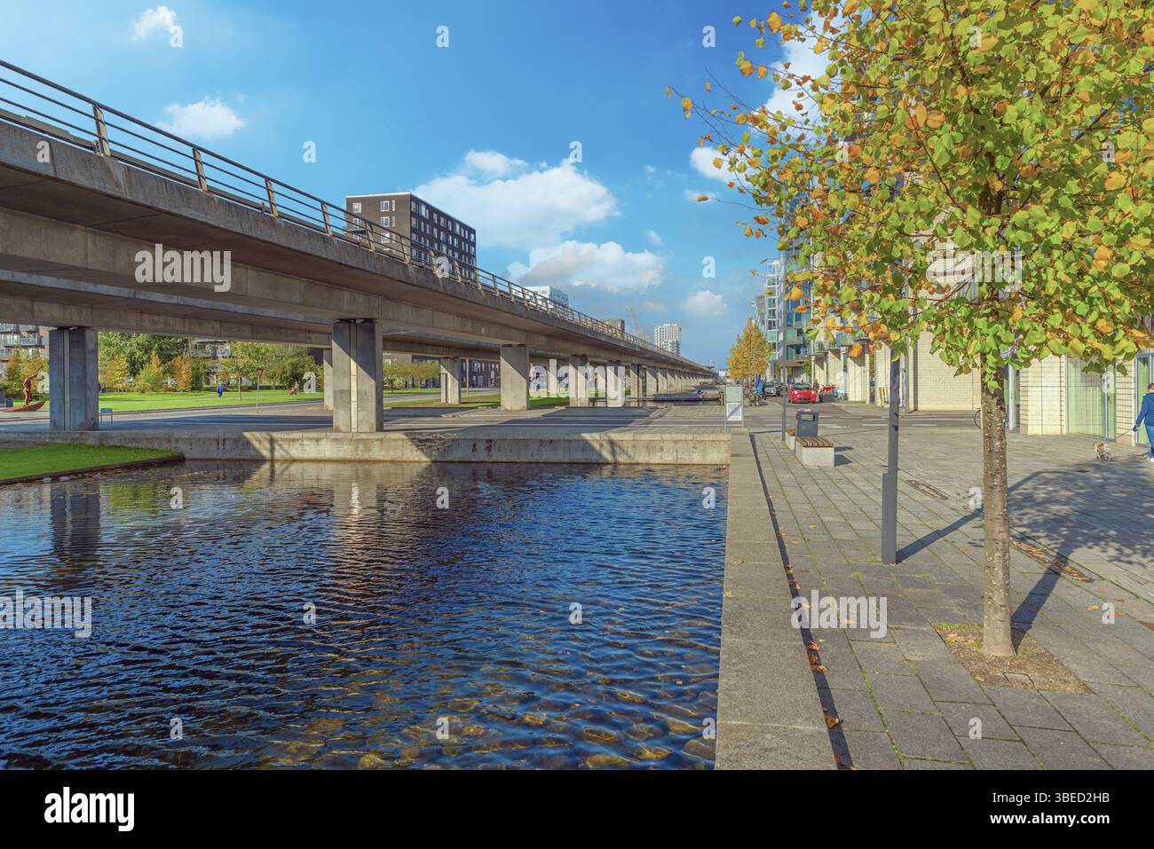 Water canal, metro line and pedestrian street near Orestad boulevard in ...
