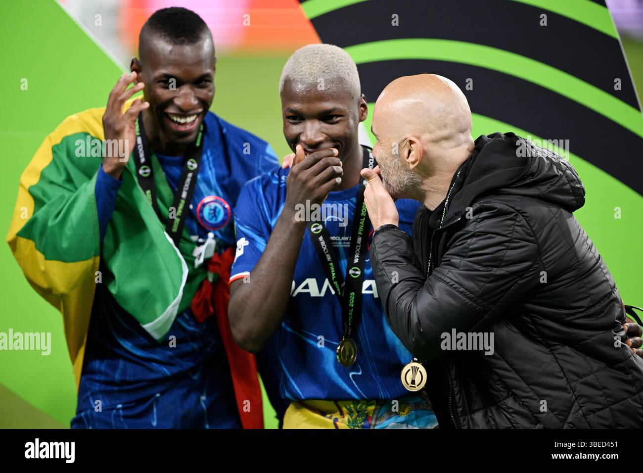 Chelsea manager Enzo Maresca (right) with Moises Caicedo and Nicolas Jackson (left) after ...