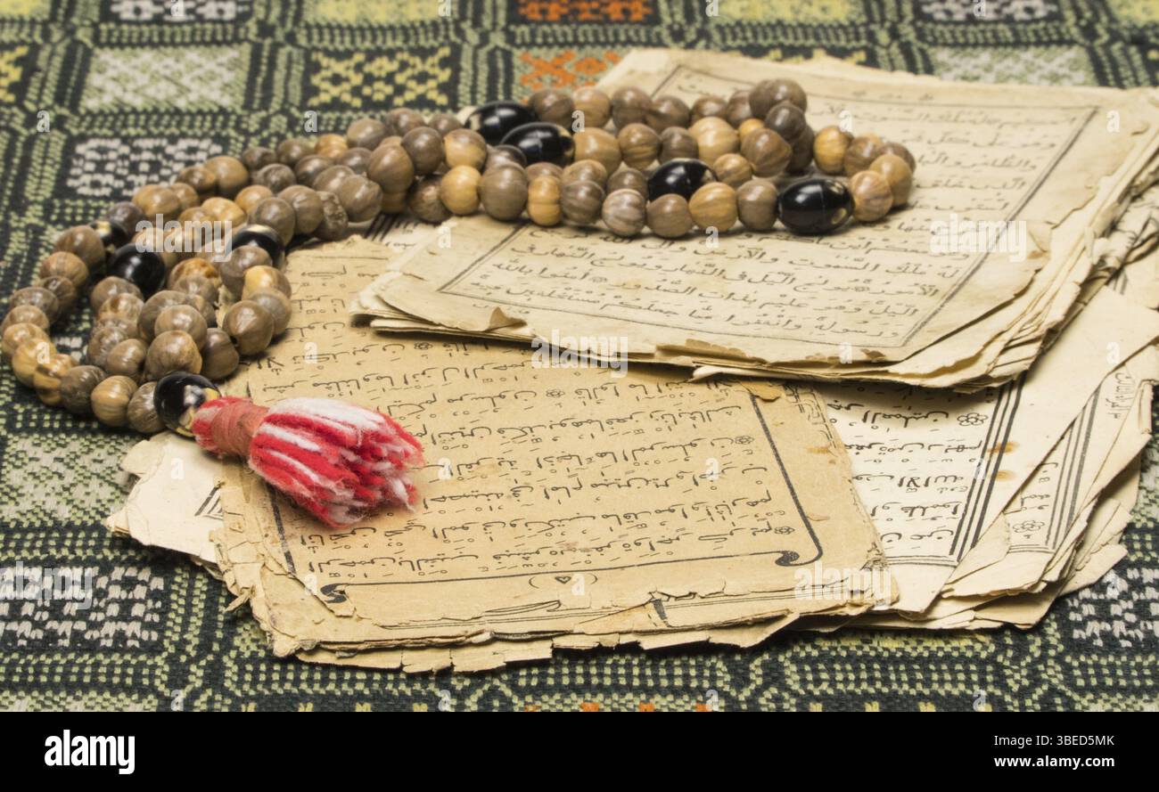 Muslim prayer beads with ancient pages from the Koran. Islamic and ...