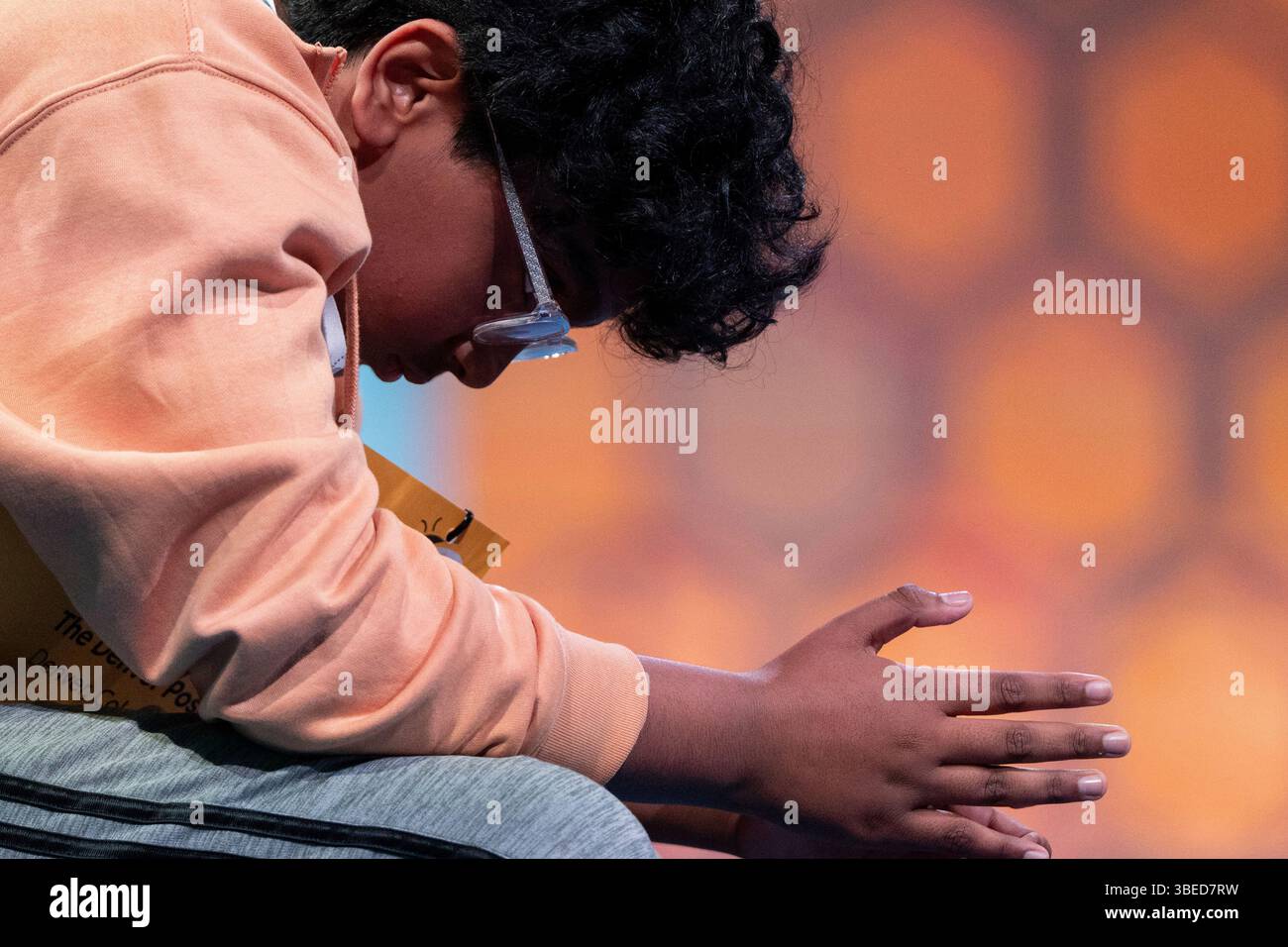 Vedanth Raju, 12, of Denver, lowers his head before competing in the ...