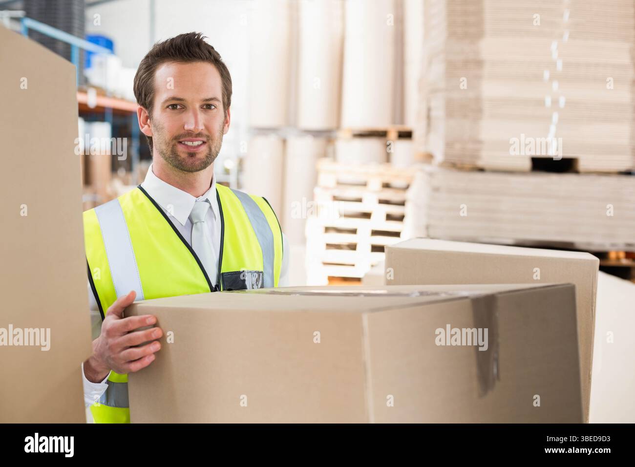 Logistics worker wearing safety vest hi-res stock photography and ...