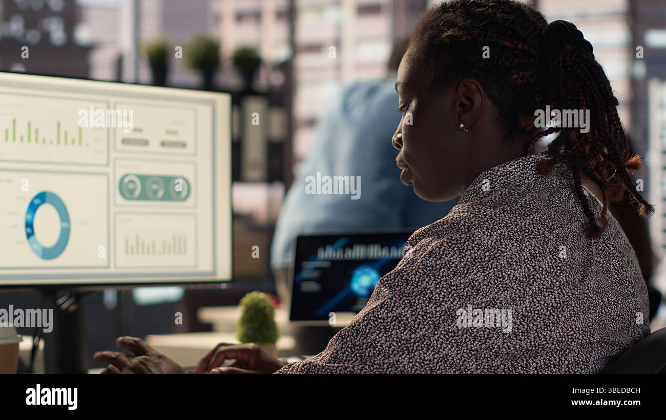 Female manager engaged in budget analysis and strategy development at ...