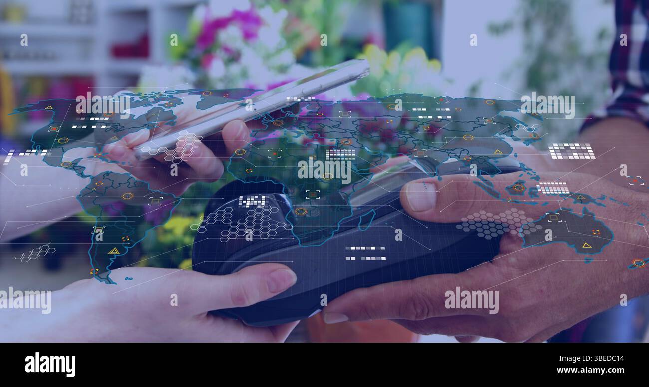 Customer and clerk exchanging payment at plant shop with smartphone ...